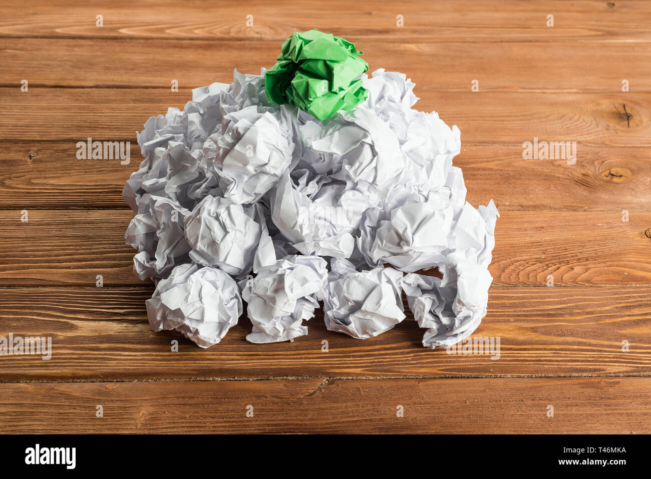 White crumpled up piece of paper on wooden table as idea Stock Photo ...