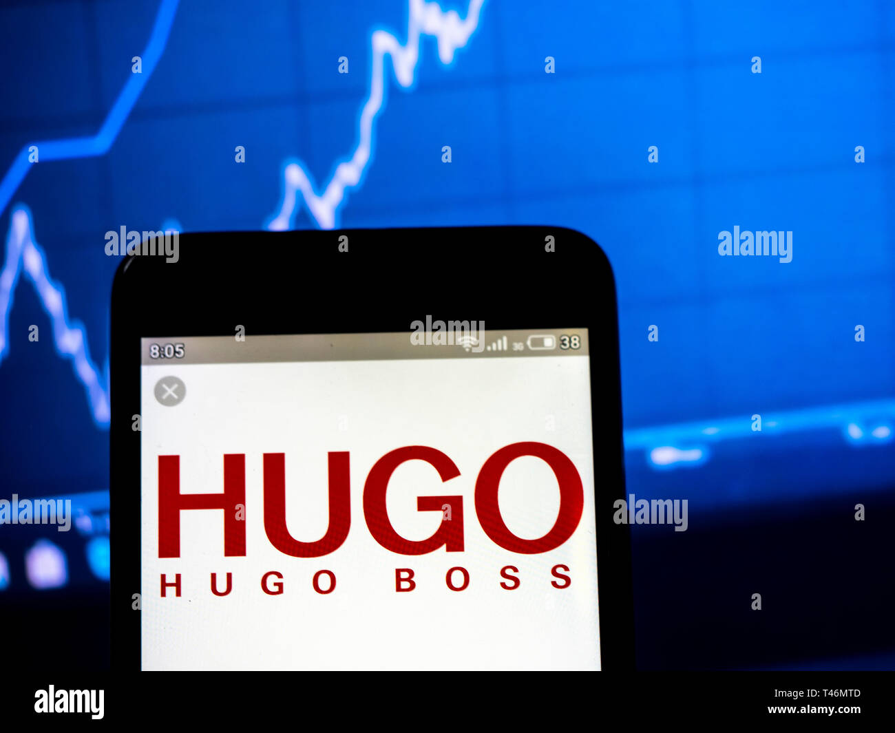 In this photo illustration a Hugo Boss AG logo seen displayed on a ...