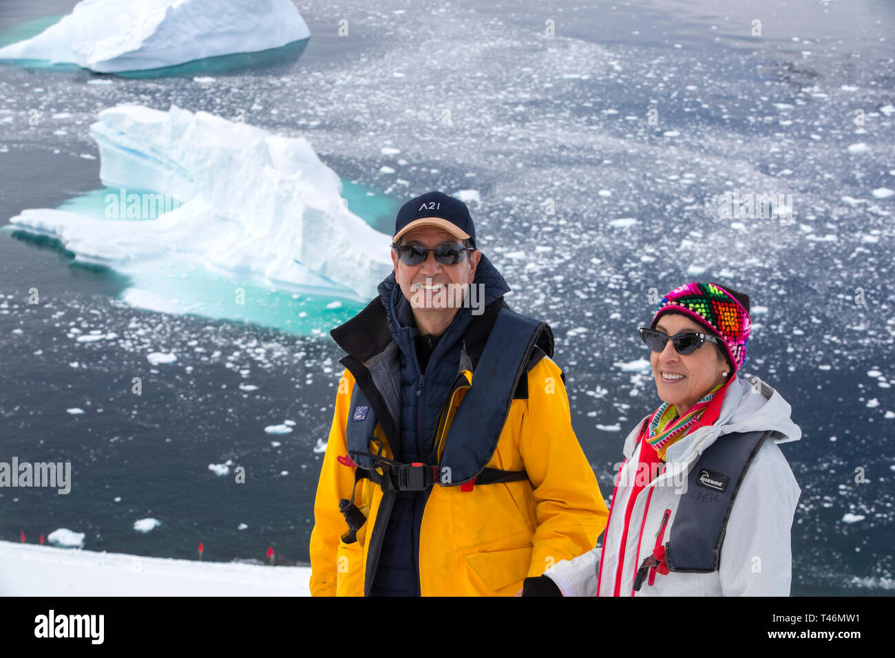 Icebergs and tourists at Orne Harbour on the Antarctic Peninsular Stock ...