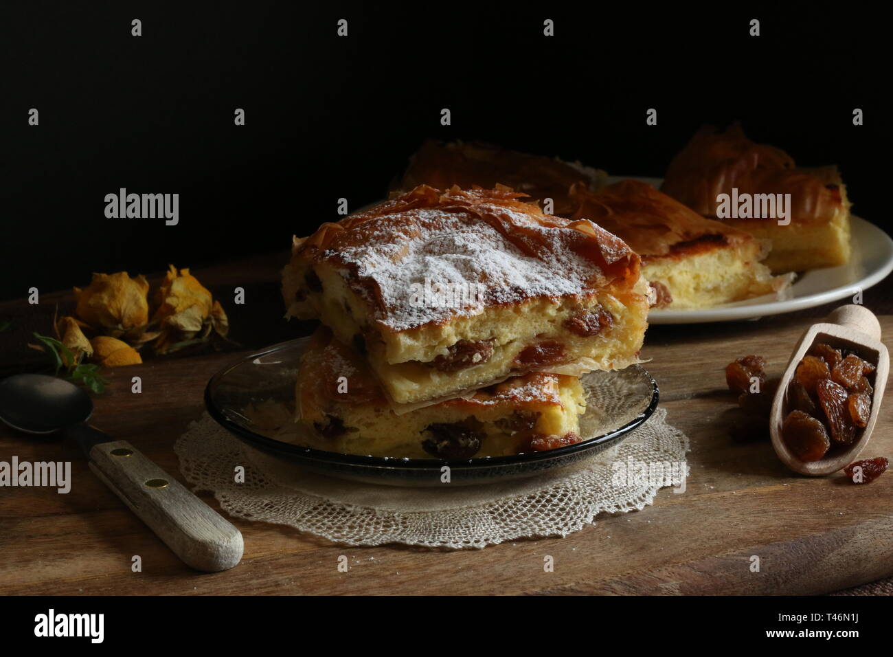 Traditional greek cuisine. Bougatsa, phyllo pastry filled with cream ...
