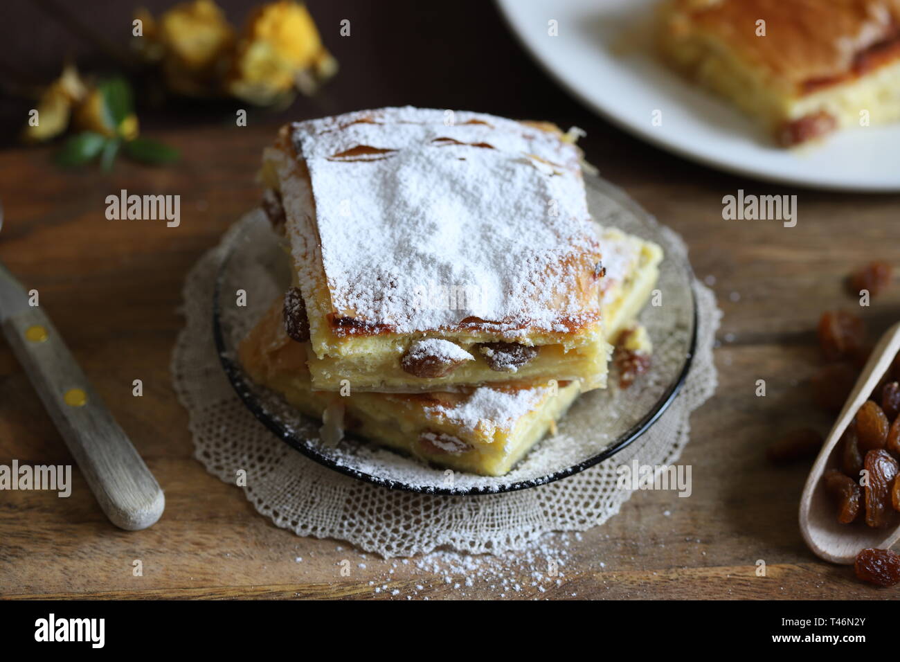 Traditional greek cuisine. Bougatsa, phyllo pastry filled with cream ...