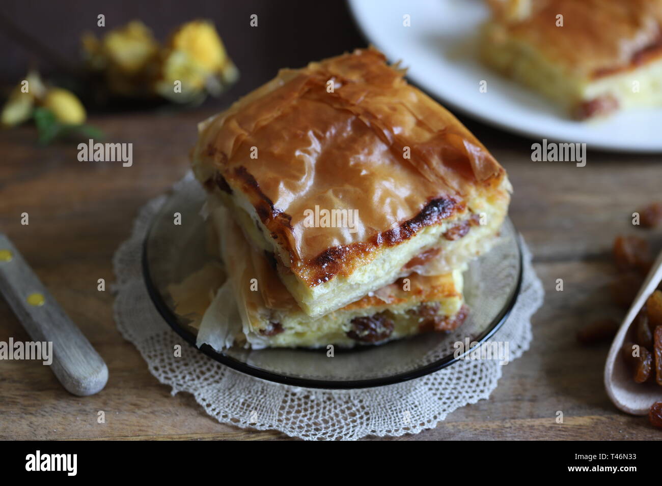 Traditional greek cuisine. Bougatsa, phyllo pastry filled with cream ...