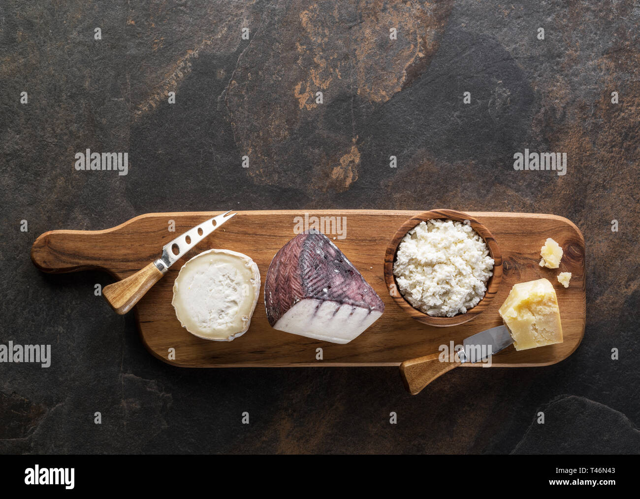 Cheese platter with different homemade organic cheeses on stone ...