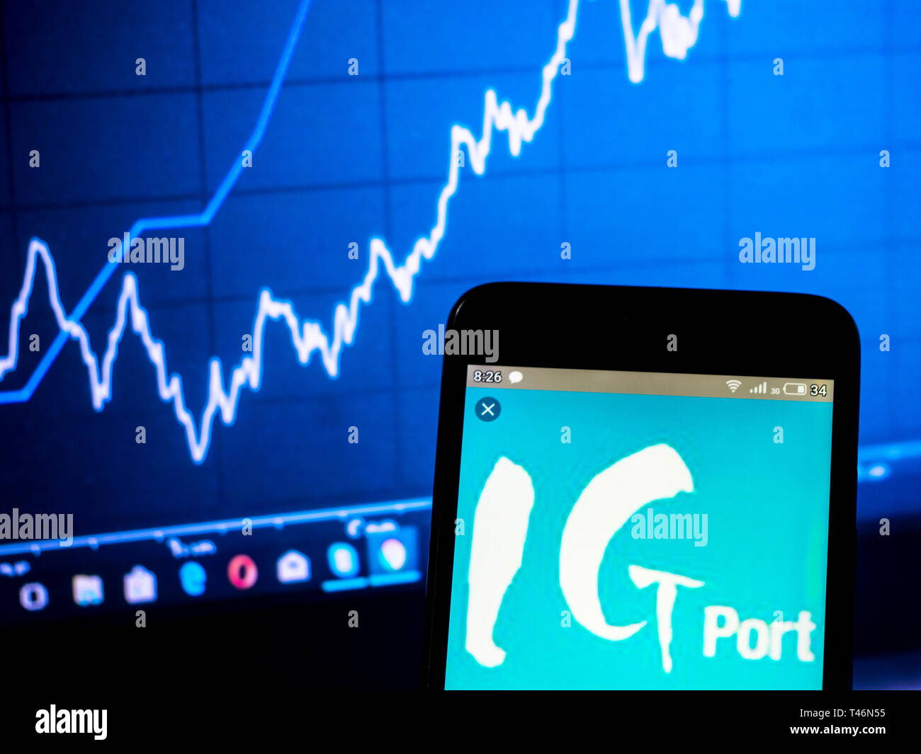 In this photo illustration an IG Port, Inc. logo seen displayed on a ...