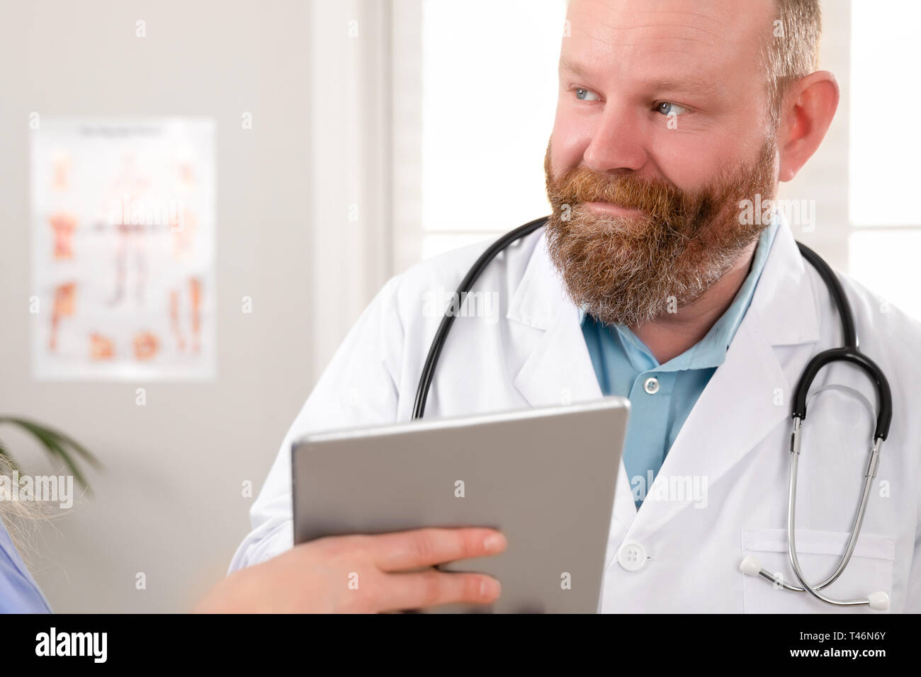 Happy female doctor tablet computer hi-res stock photography and images ...