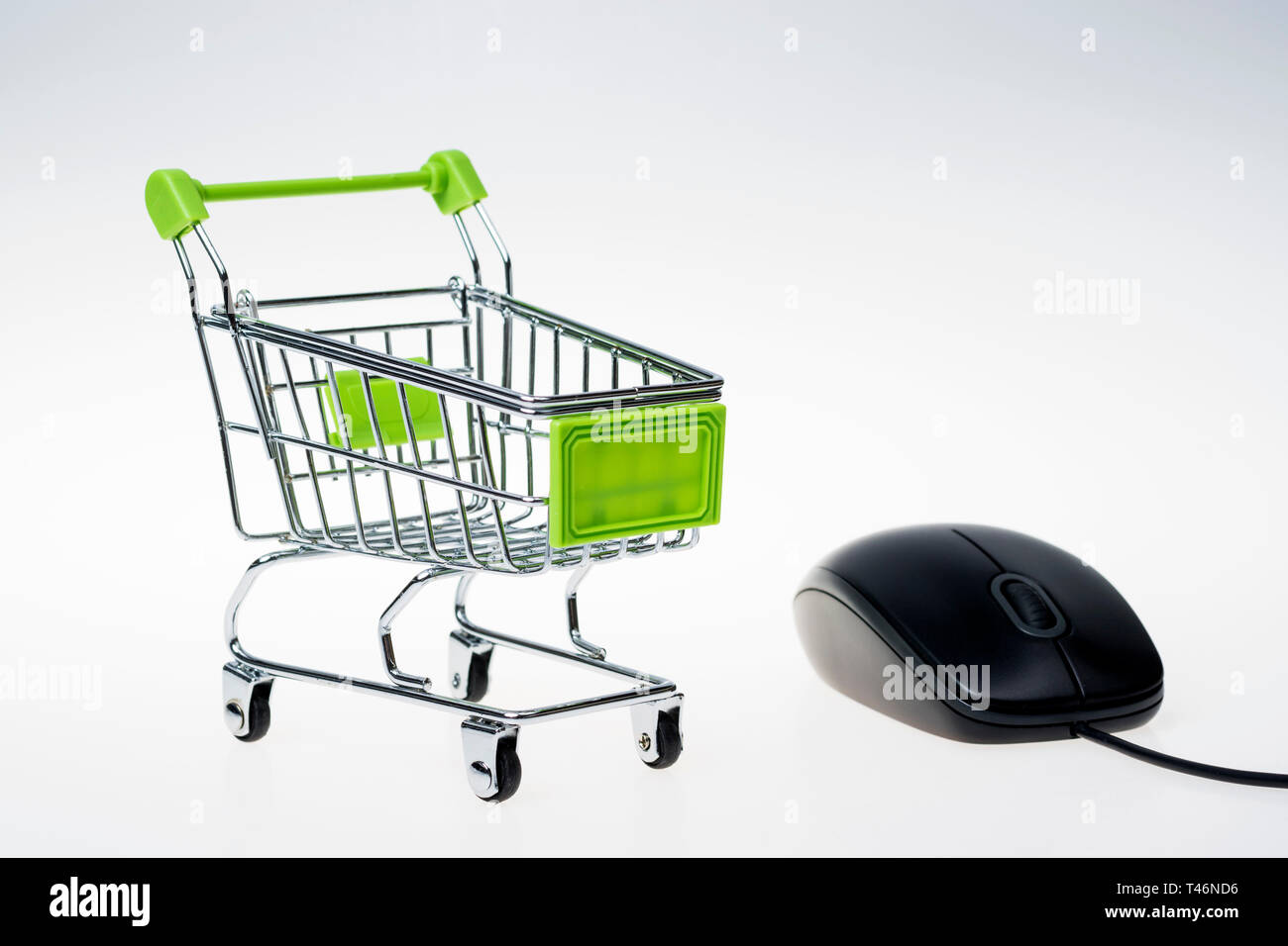 Internet online shopping concept. Computer mouse and cart Stock Photo ...