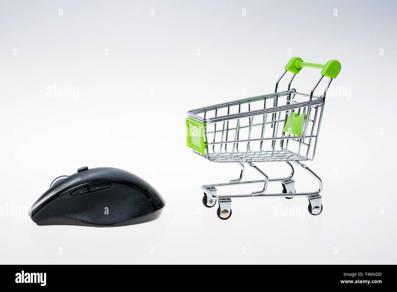 Internet online shopping concept. Computer mouse and cart Stock Photo ...