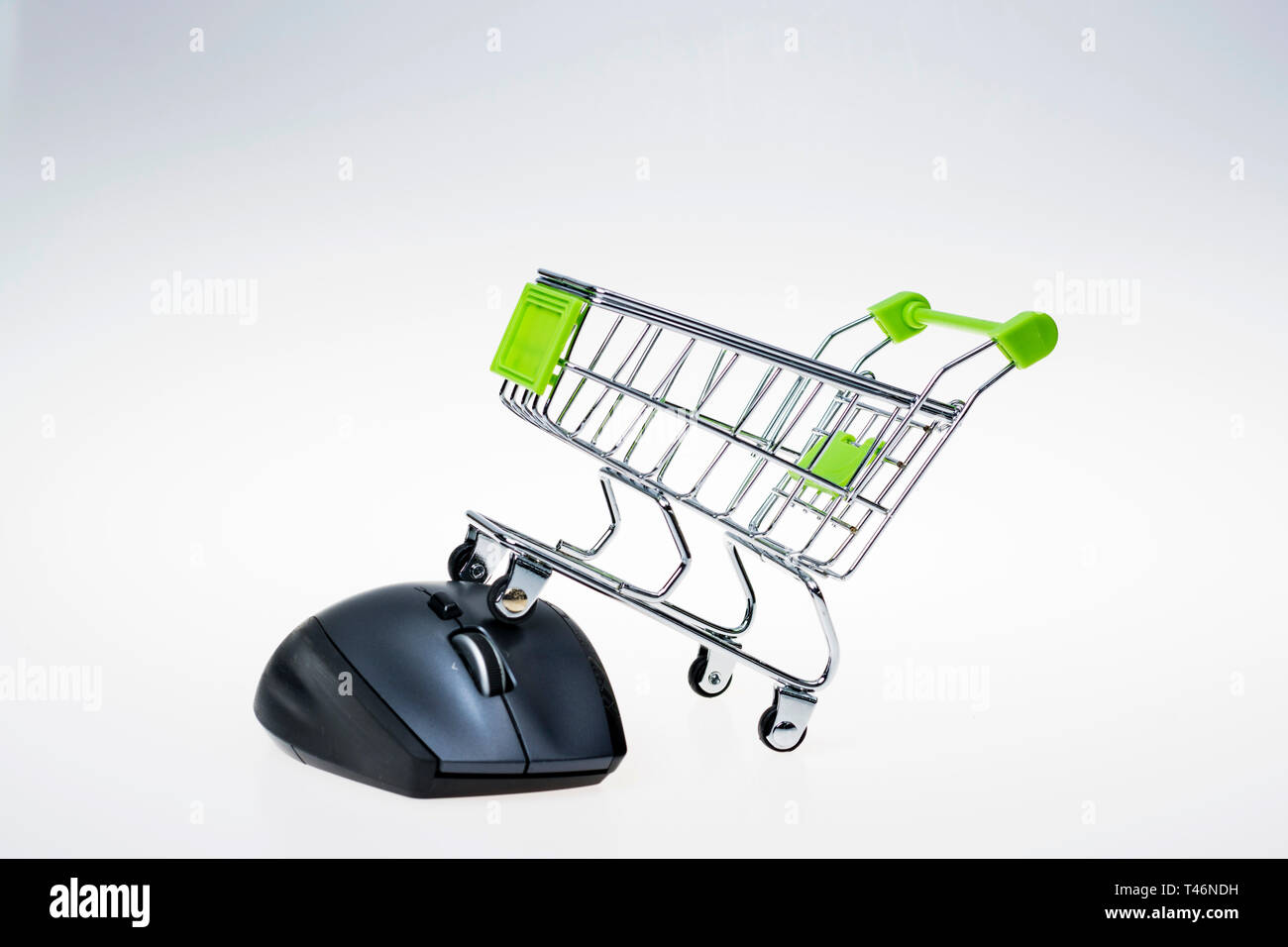 Internet online shopping concept. Computer mouse and cart Stock Photo ...