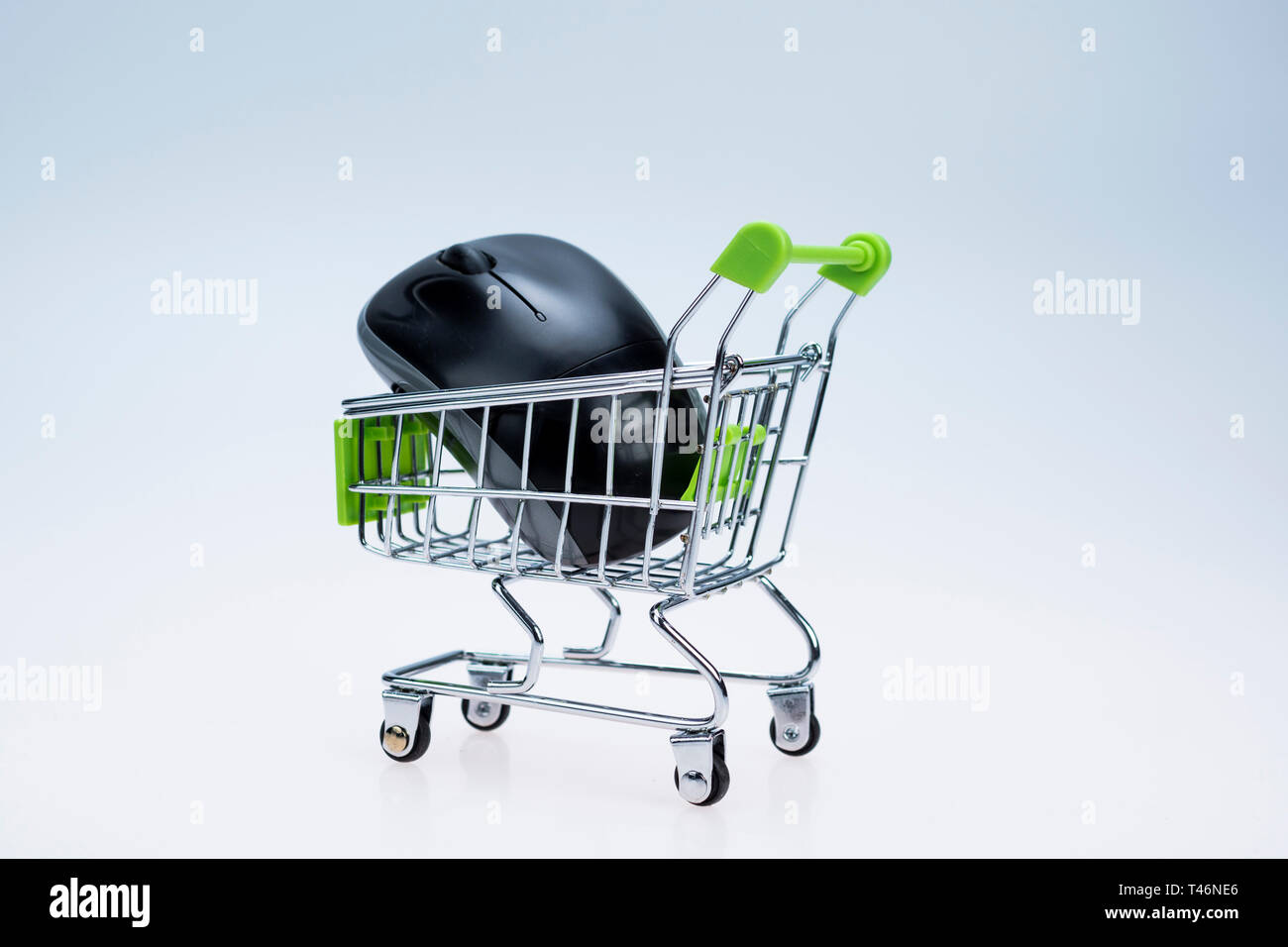 Internet online shopping concept. Computer mouse and cart Stock Photo ...