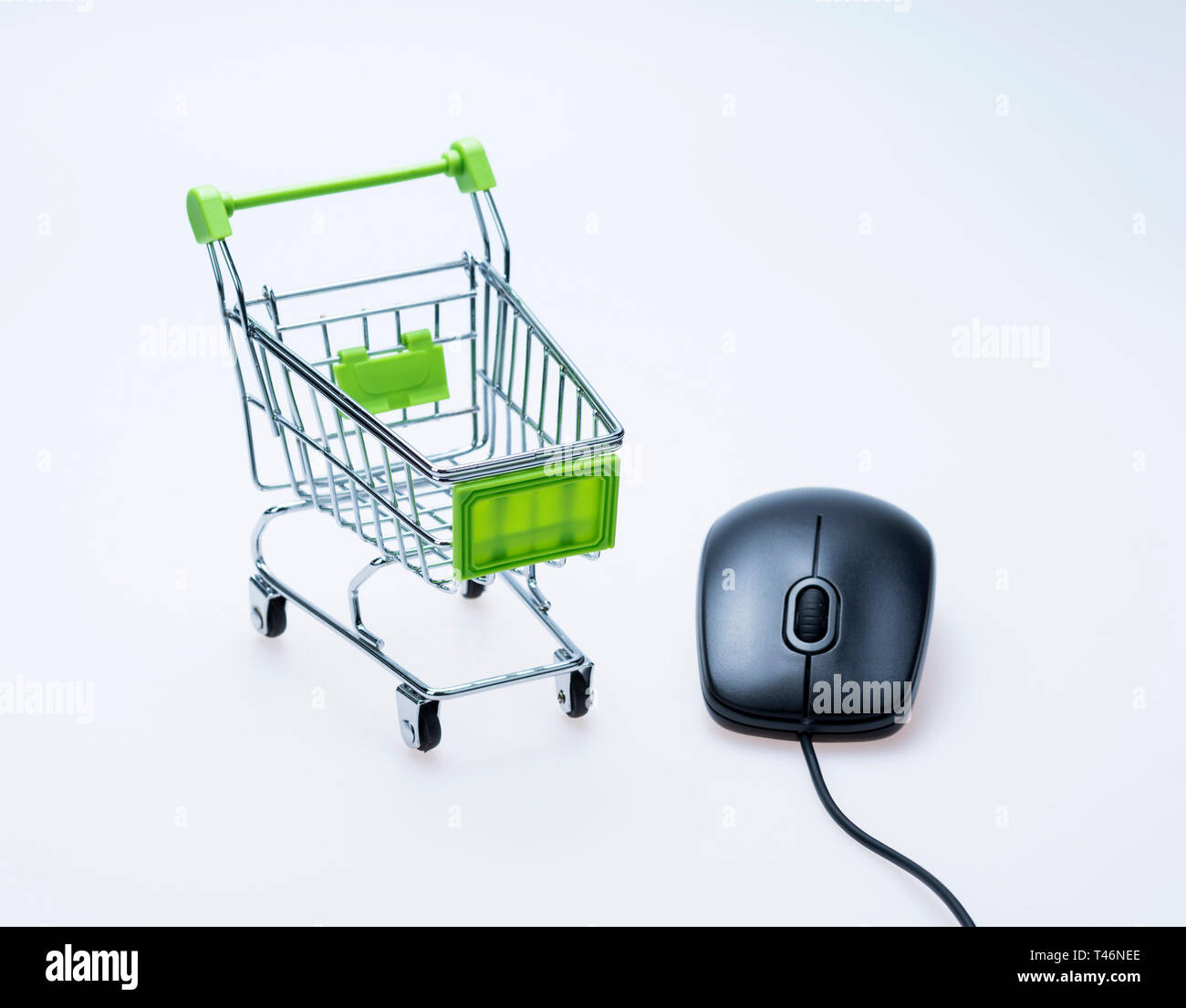 Internet online shopping concept. Computer mouse and cart Stock Photo ...