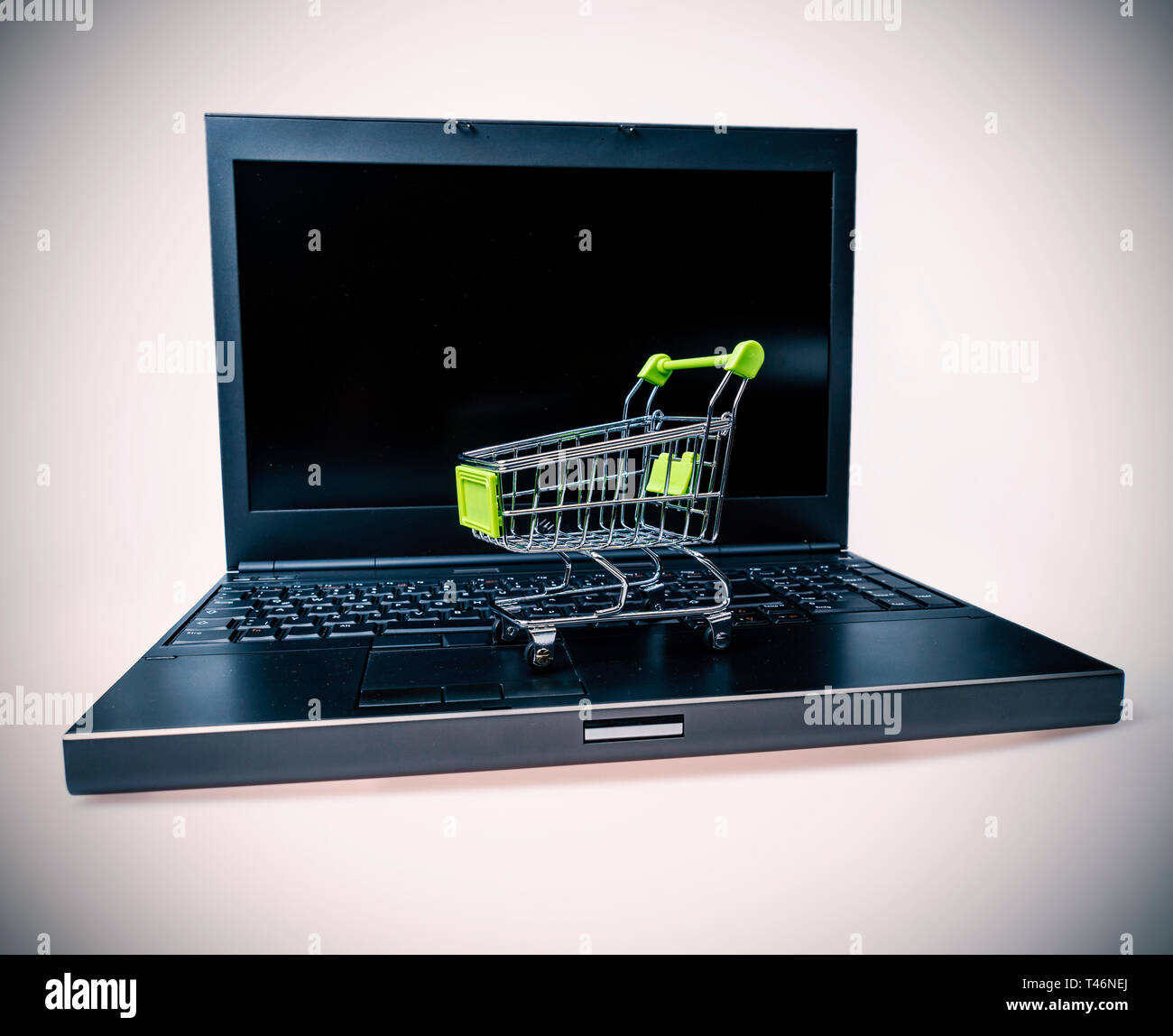 E-commerce. Shopping cart on laptop. Conceptual image Stock Photo - Alamy