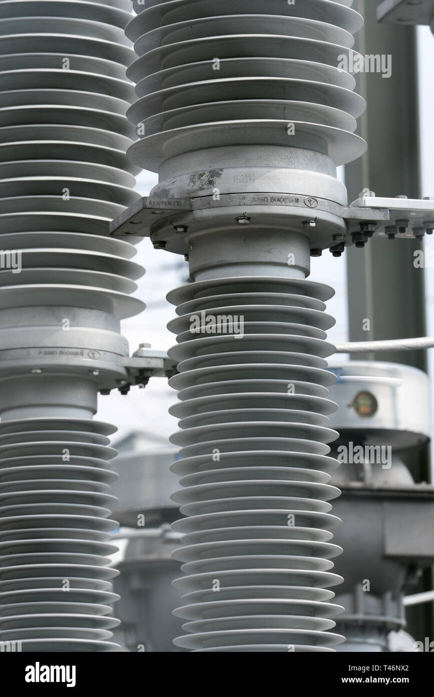 A detail view of transformers and conduits at an electric power station ...