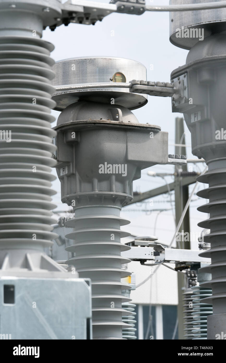 A detail view of transformers and conduits at an electric power station ...