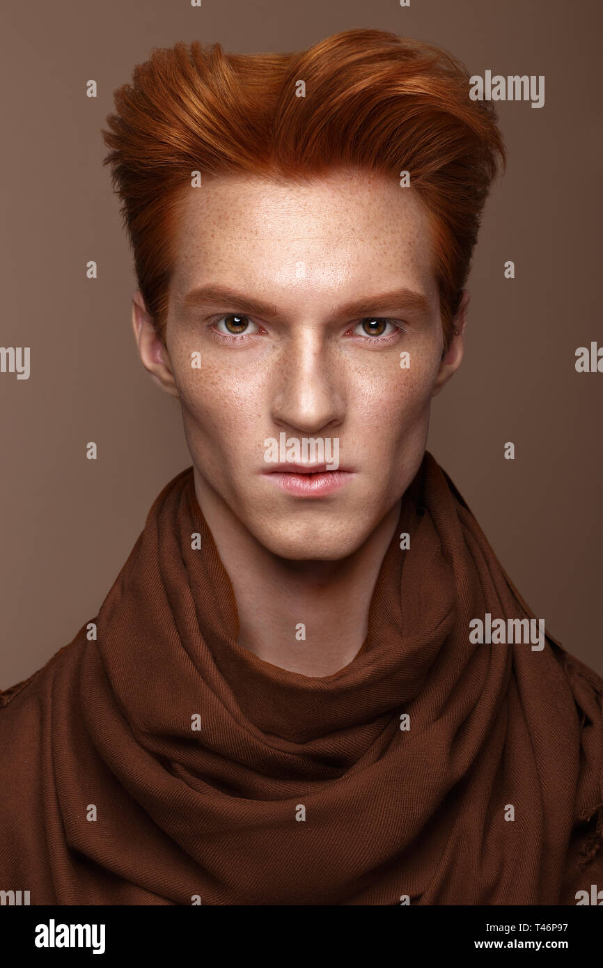 Young man with red hair and creative make up and hair Stock Photo - Alamy