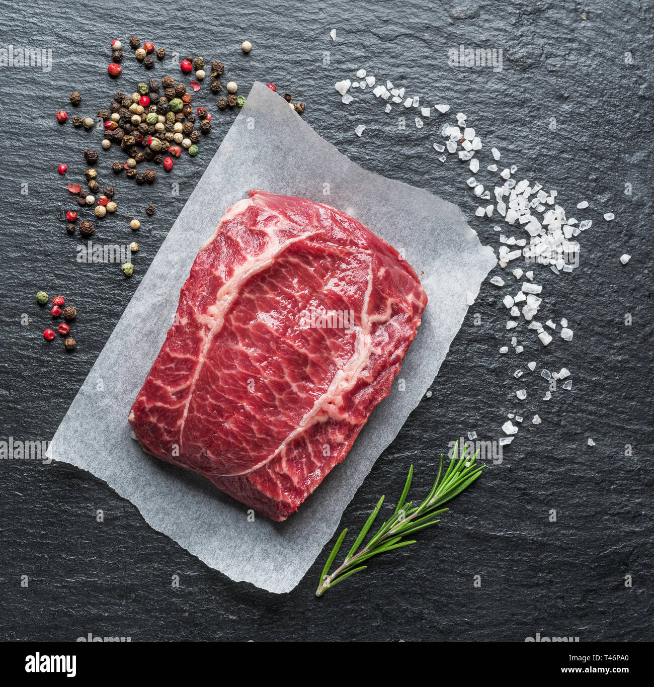 The top blade steak or beef steak on the graphite board with herbs and ...