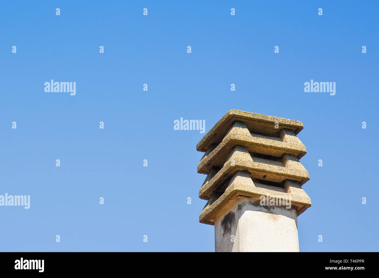 Prefabricated concrete chimney on blue background with copy space Stock ...