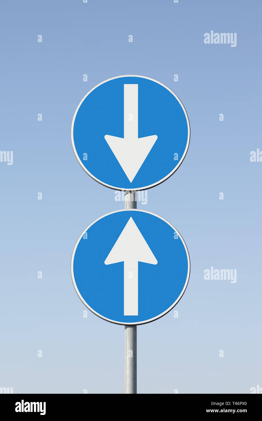 Contradiction concept with road signs - concept image Stock Photo - Alamy