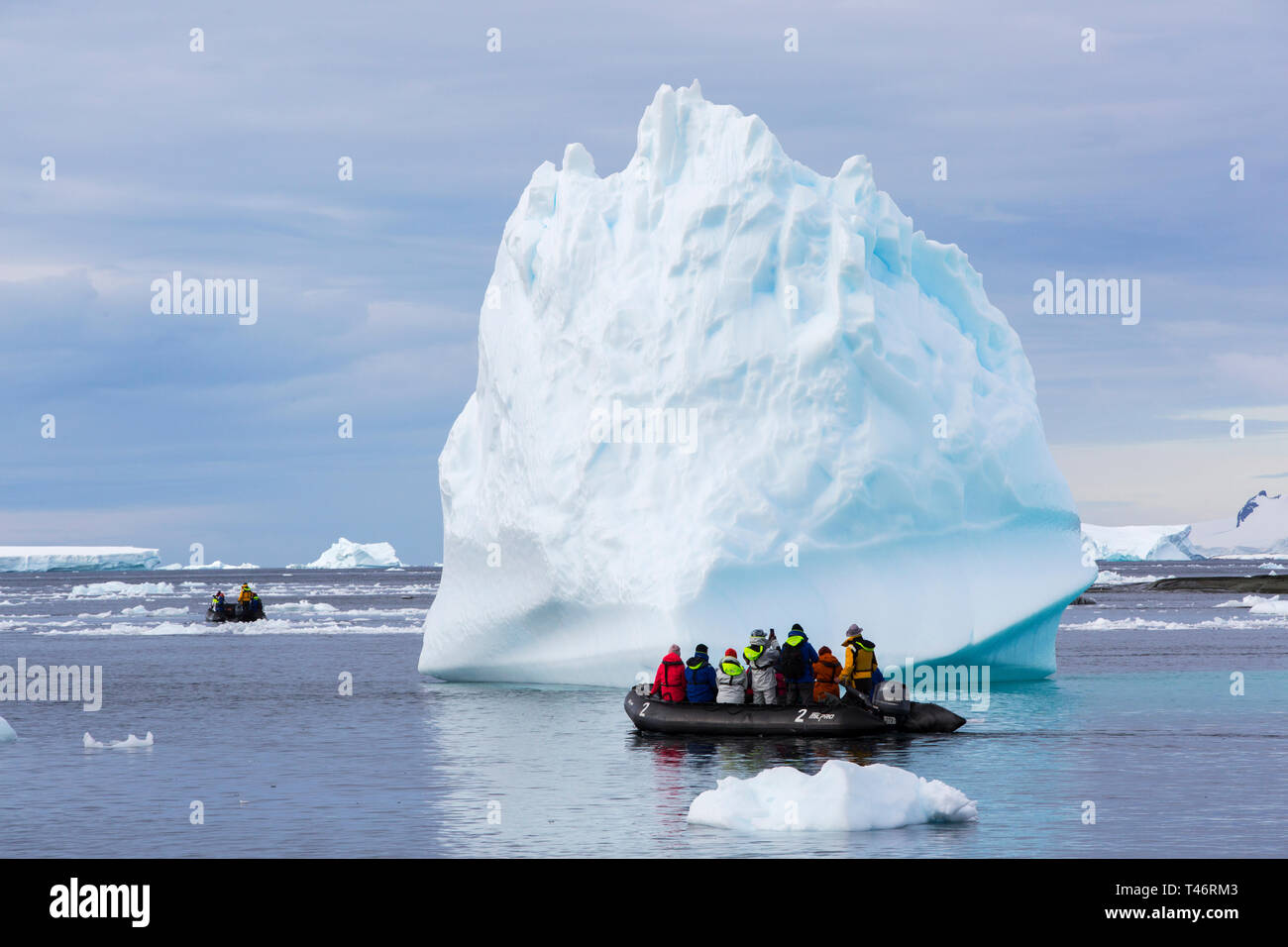 Icebergs and tourists at Orne Harbour on the Antarctic Peninsular Stock ...