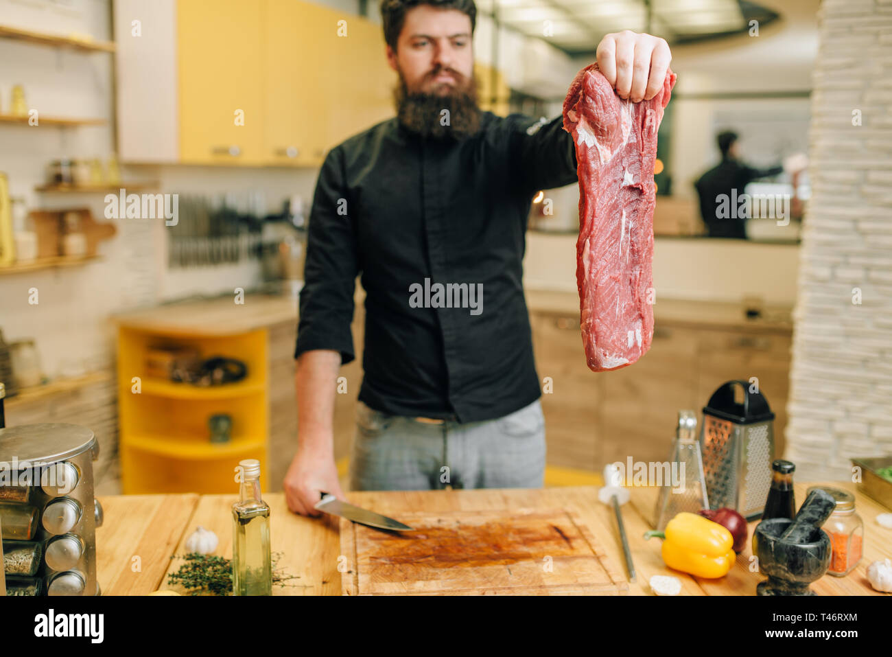 Chef cutting fresh beef meat hi-res stock photography and images - Alamy