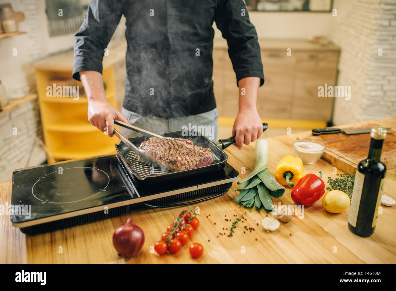 Chef cooking meat on restaurant hi-res stock photography and images - Alamy