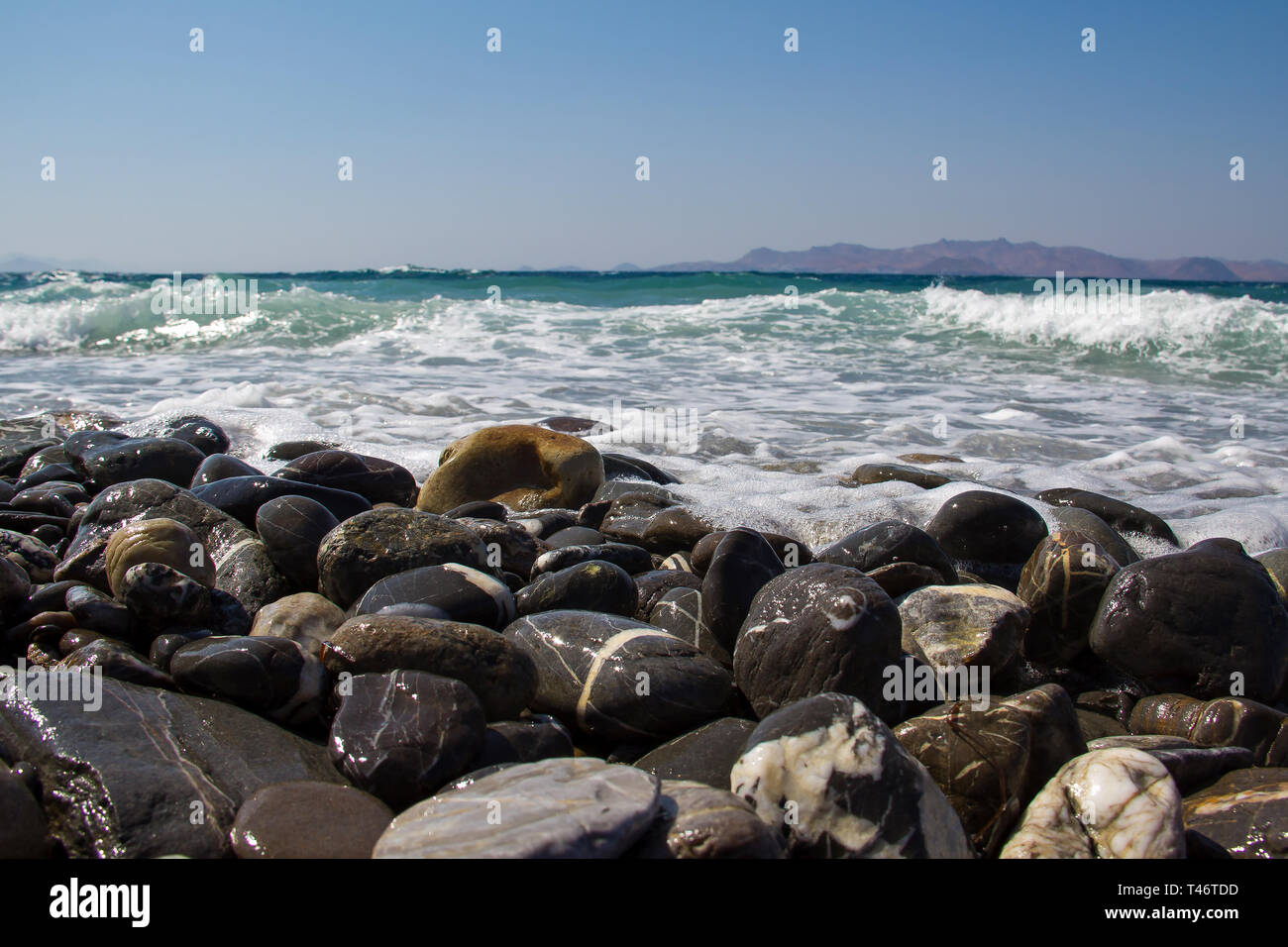 Pebble beaches of the Aegean Sea on the island of Kos in Greece Stock ...