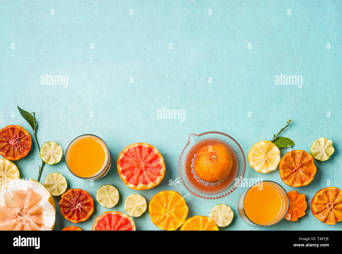 Citrus food background. Variety of citrus fruits and juice on light ...