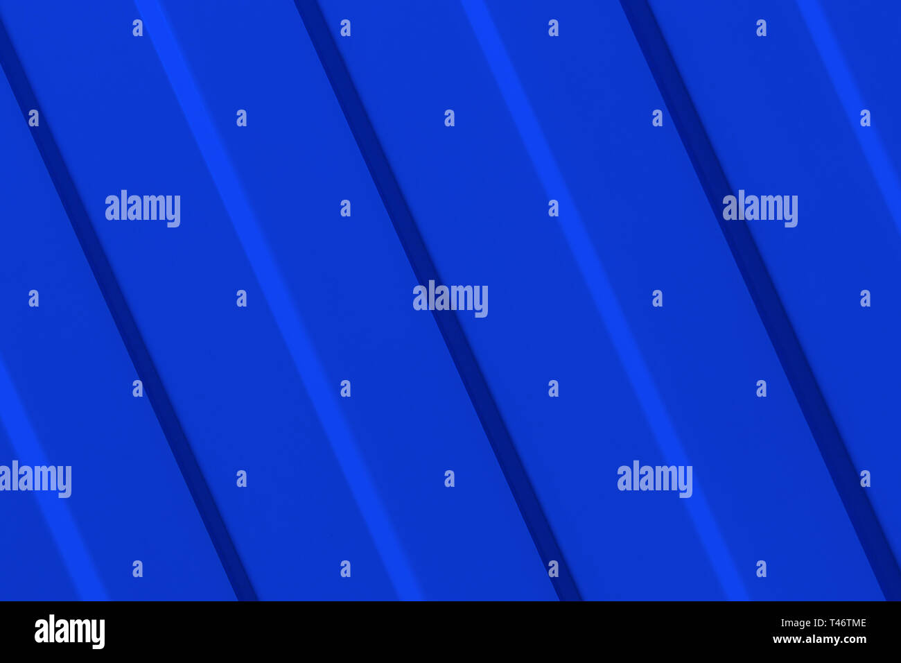 The surface of the metal profiled panel in blue close-up. Diagonal ...