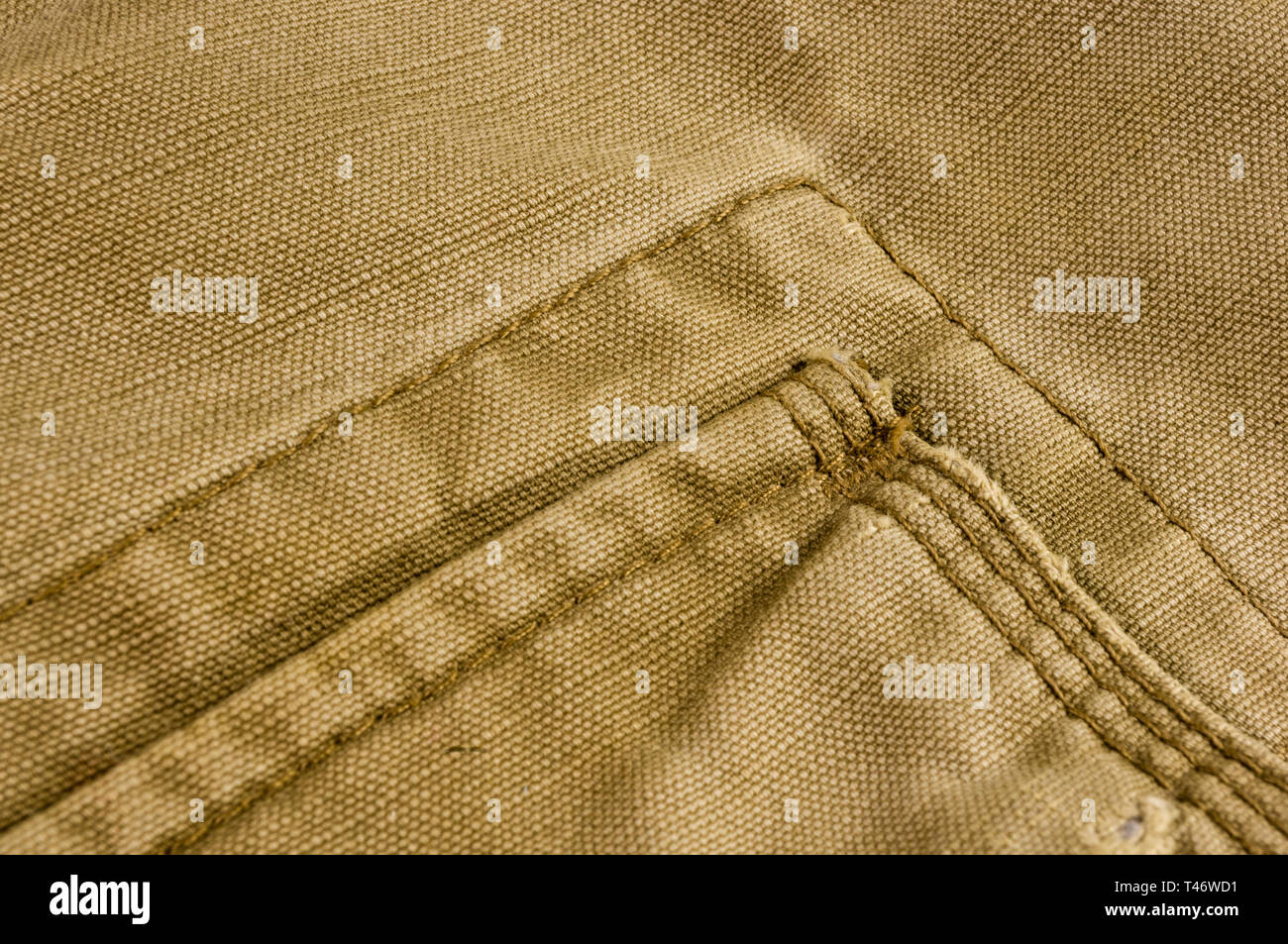 clothing items washed cotton fabric texture with seams, macro, close-up ...