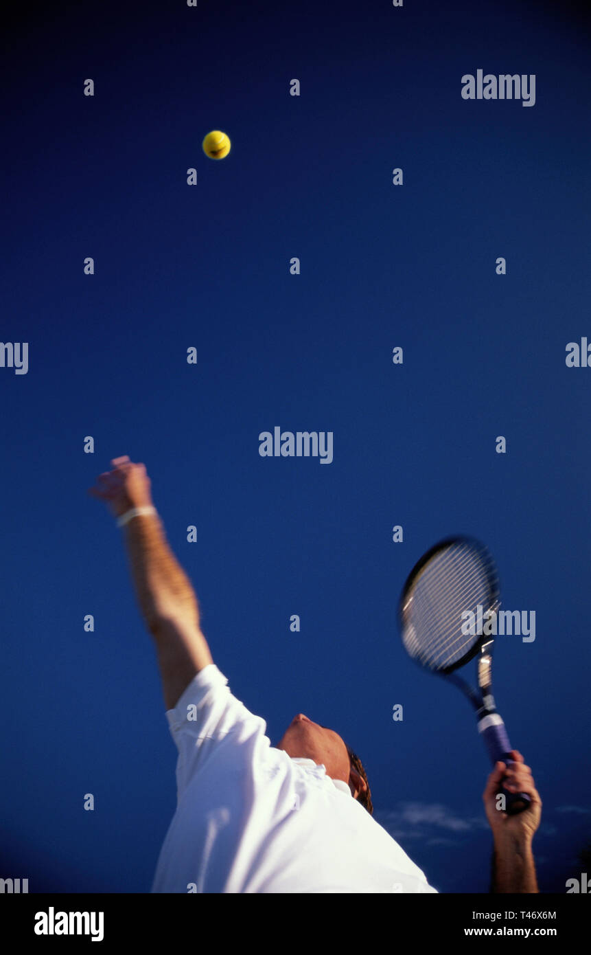 Male Tennis Player in Classic Whites Serving Ball, USA Stock Photo - Alamy