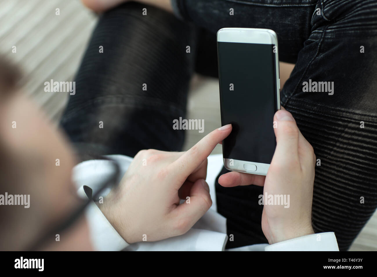 close up.modern man typing SMS on his smartphone. people and technology ...