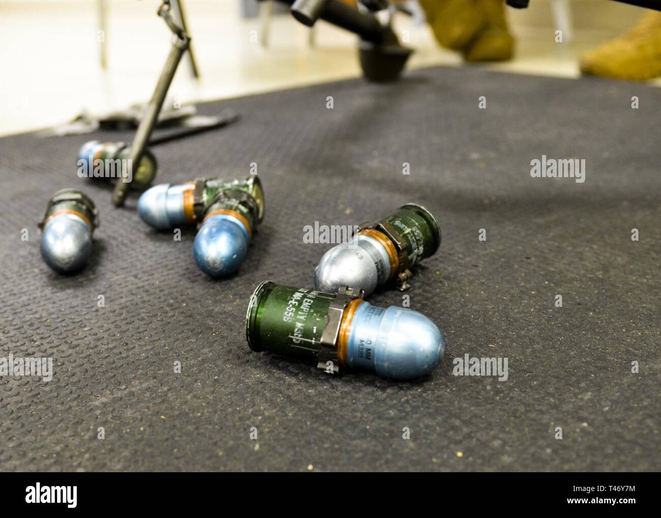 Dummy rounds for an M19 40 mm automatic grenade launcher lay on the ...