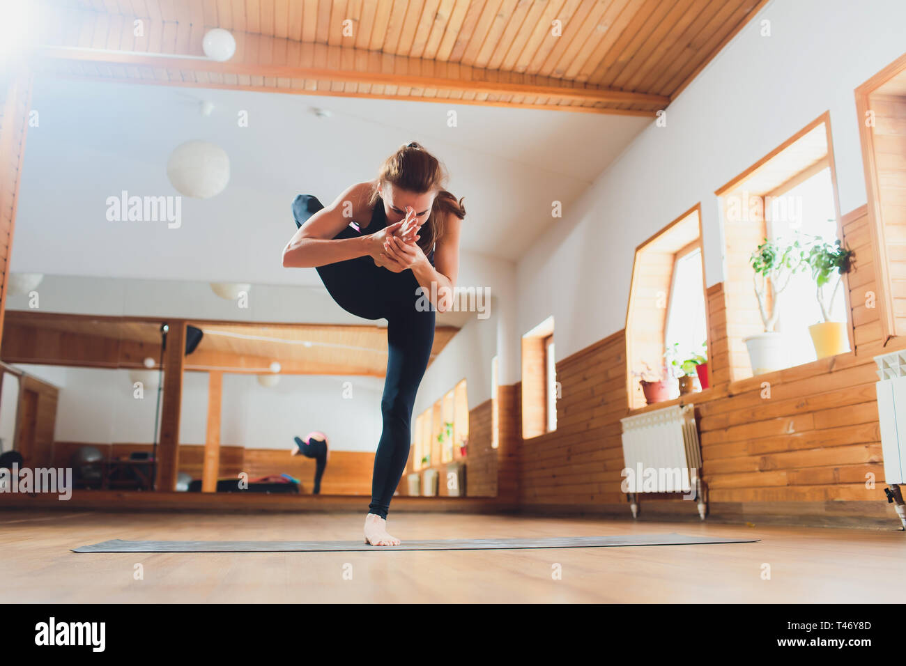 Portrait of sporty beautiful blond young woman in sportswear working ...