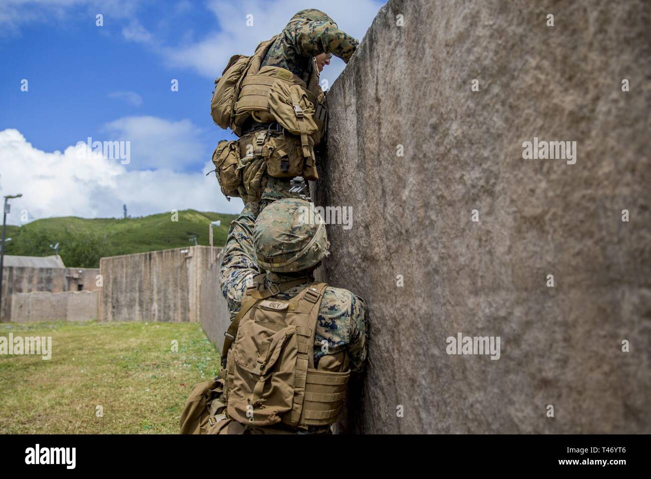 U.S. Marines with Golf Co., 2nd Battalion, 3rd Marine Regiment, clear a ...