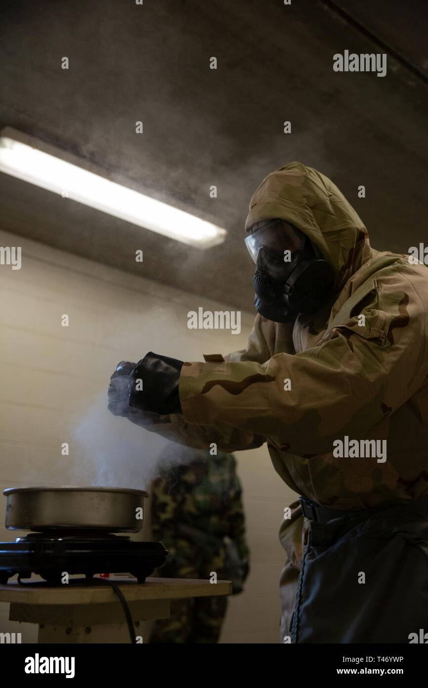 U.S. Marine Col. Frank Latt breaks capsules that release 2 ...