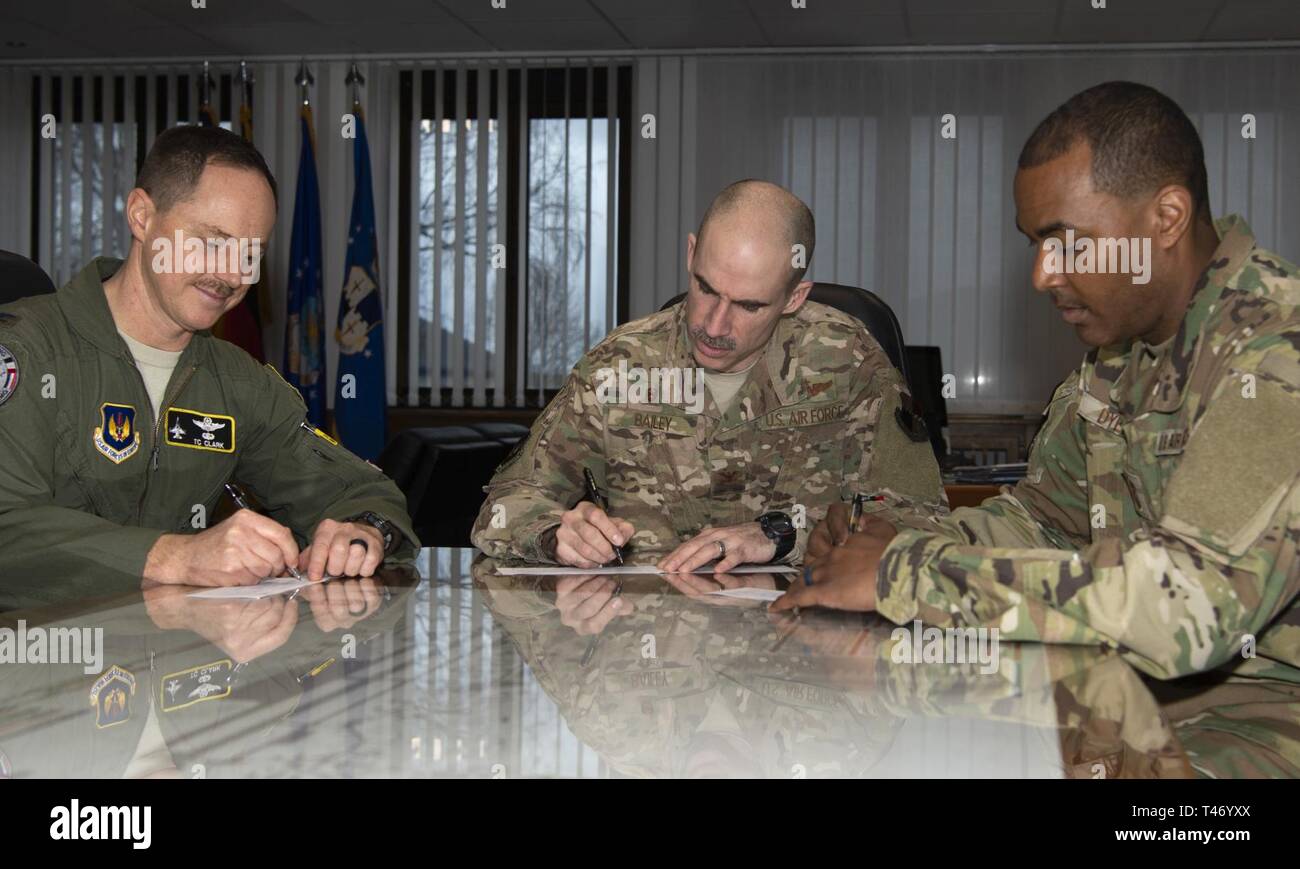 U.S. Air Force Col. Jason Bailey, 52nd Fighter Wing commander, center ...