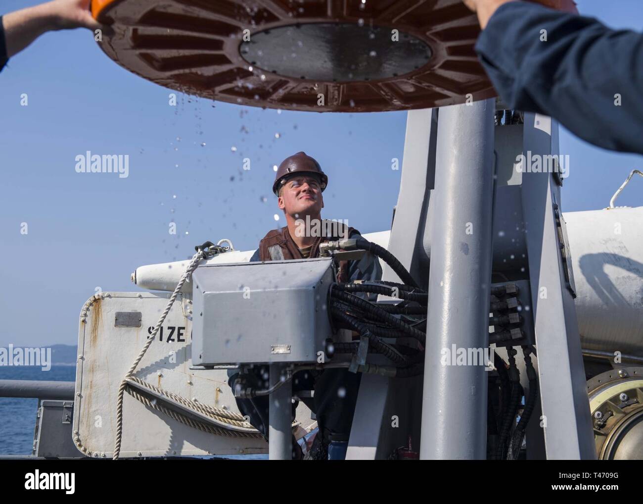 PHILIPPINE SEA (March 13, 2019) Mineman 3rd Class Joseph Knapp operates ...