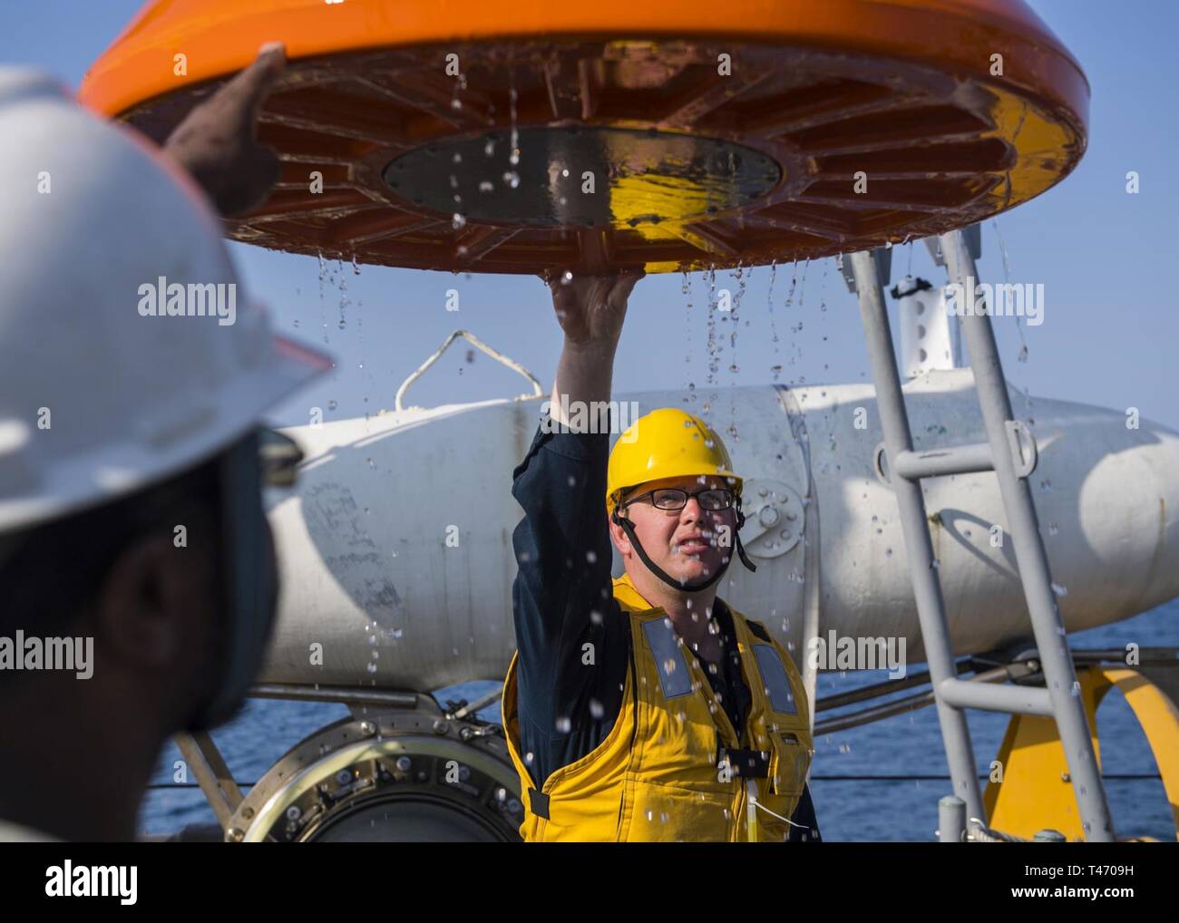 PHILIPPINE SEA (March 13, 2019) Mineman 1st Class Timothy Tate guides a ...