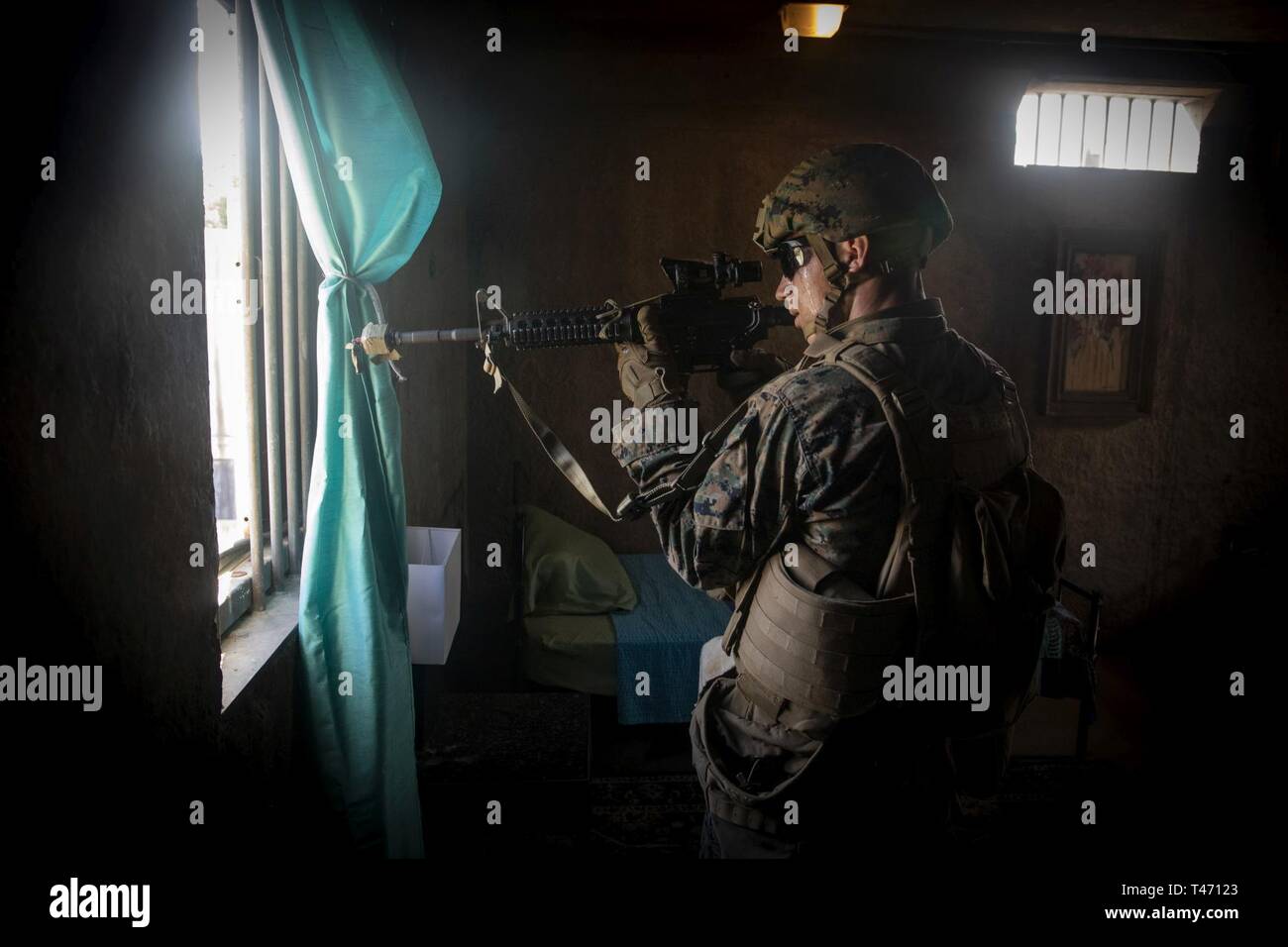 A U.S. Marine with Golf Company, 2nd Battalion, 3rd Marine Regiment ...