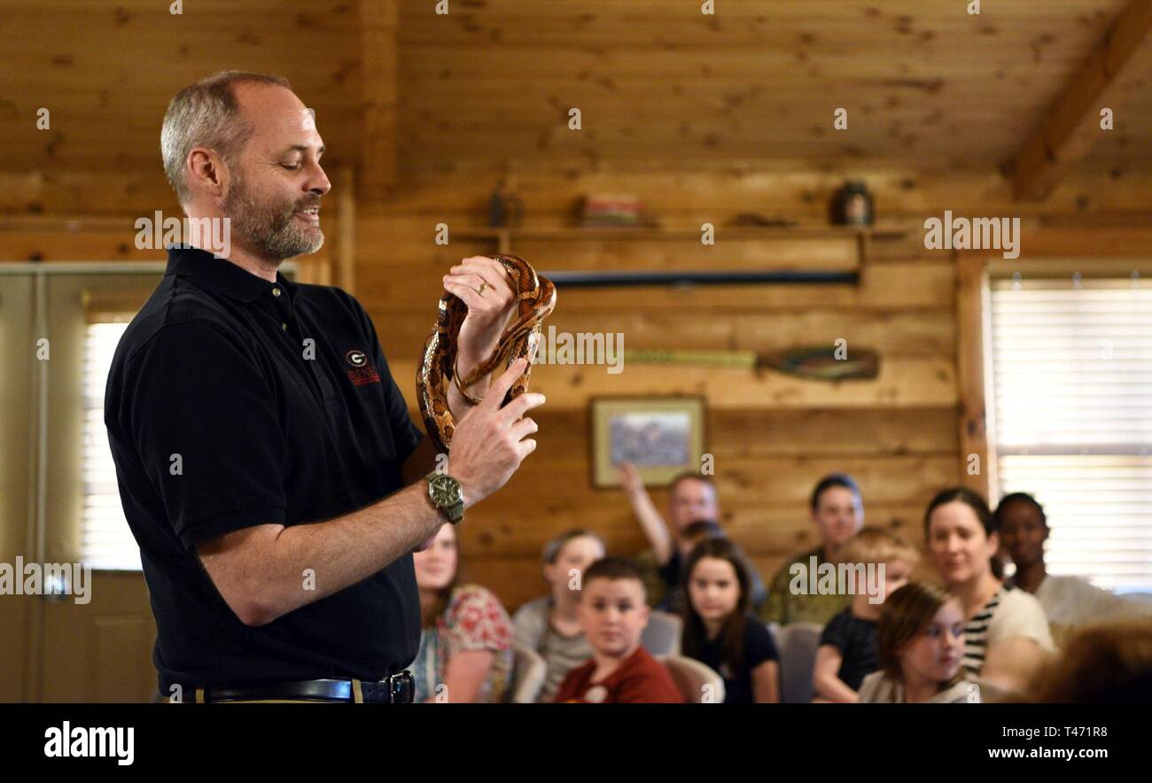 Dr. John Marez, University of Georgia professor, handles a corn snake ...