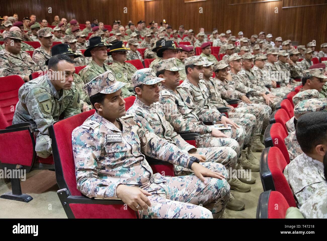 U.S. Army and Jordan Armed Forces soldiers listen to a guest speaker ...
