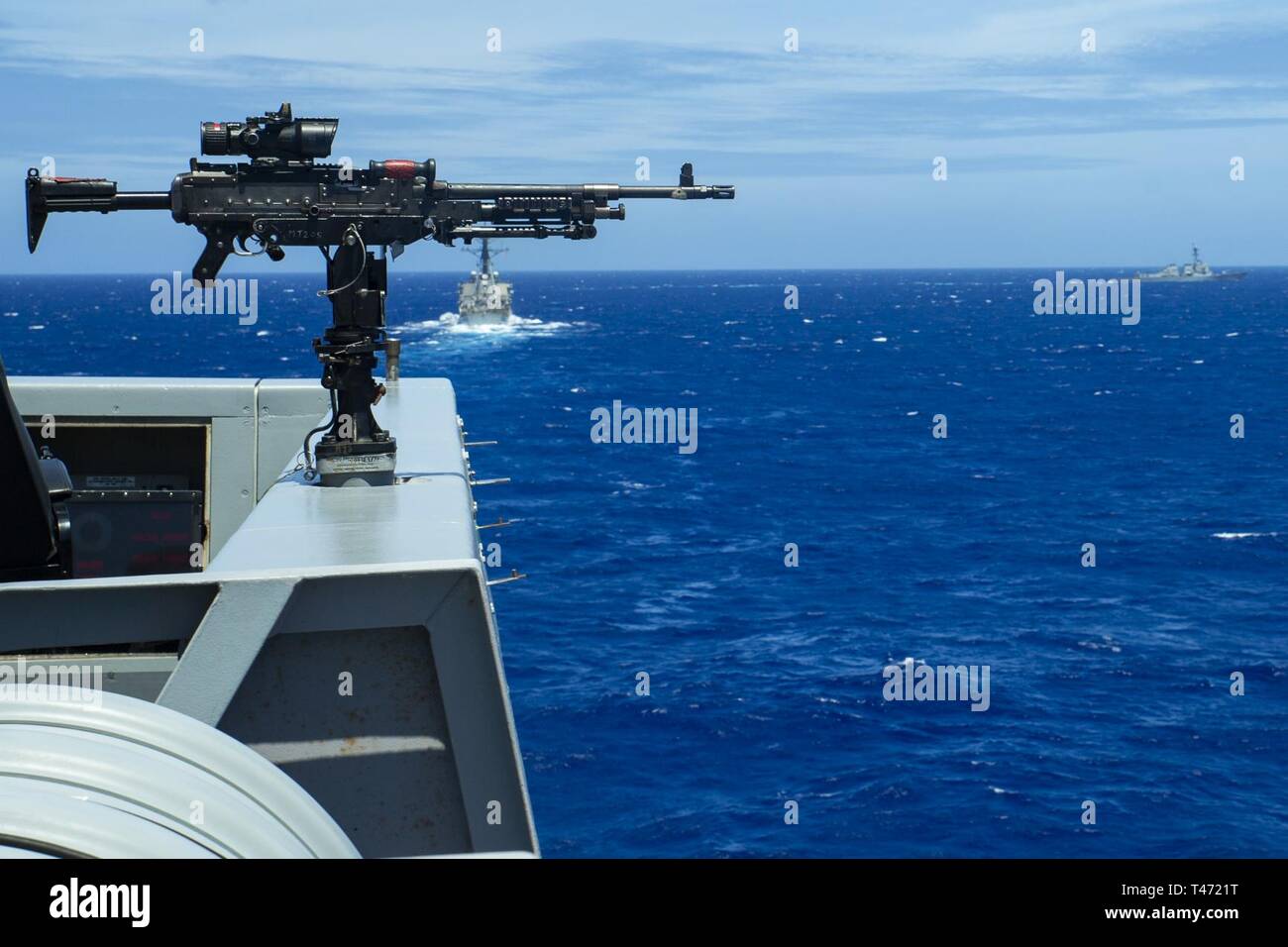 An M240B medium machine gun sits mounted aboard the USS Green Bay (LPD ...