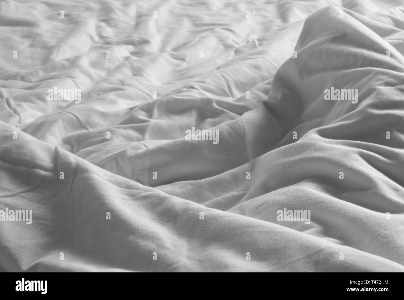 The white and clean blanket crumpled on bed Stock Photo - Alamy