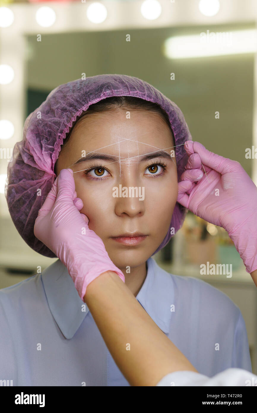 Microbleeding and eyebrow architecture. Beautician circuit generates ...