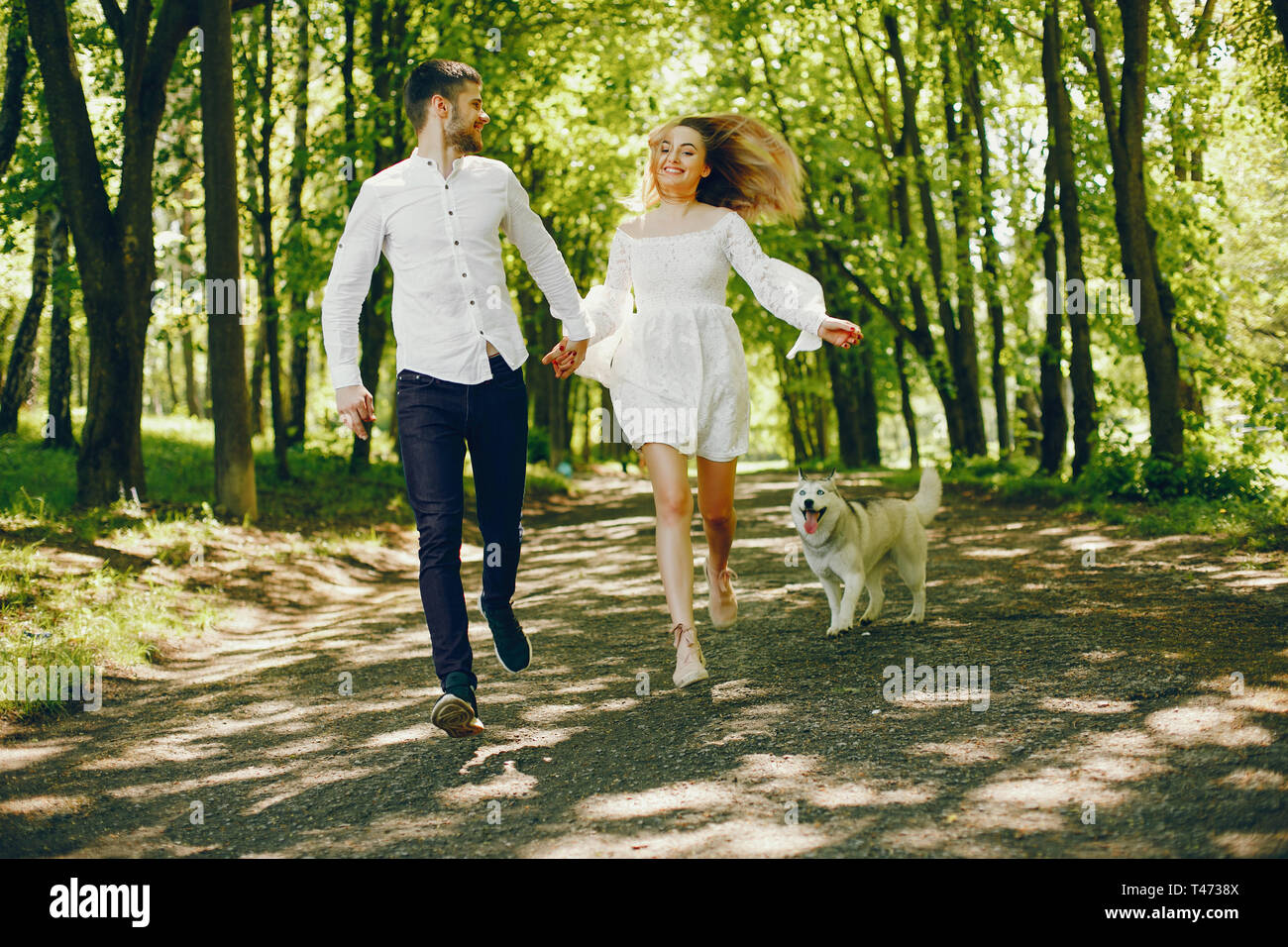elegant couple in a forest Stock Photo - Alamy