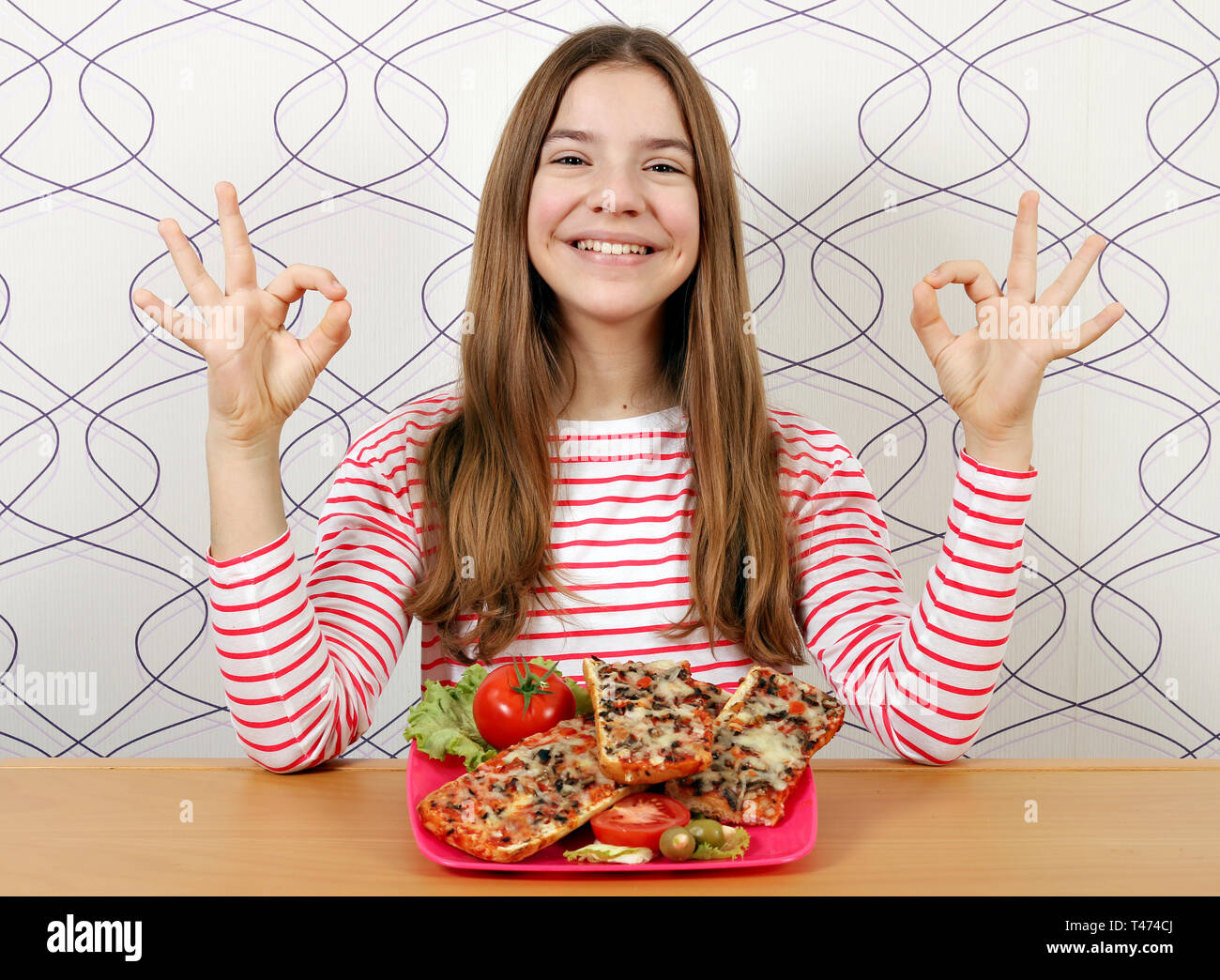 Happy teenage girl with sandwiches and ok hand signs Stock Photo - Alamy