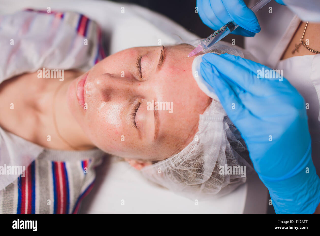 Beautician making injection in woman's face, closeup. Biorevitalization ...