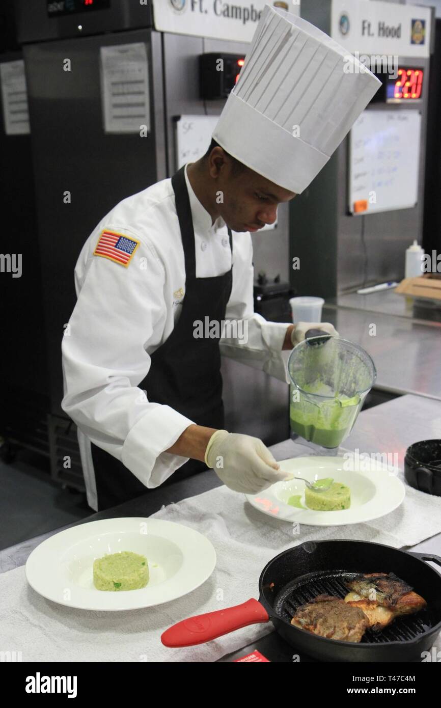 Pfc. Trevon Golden, a culinary arts specialist, prepares apple fennel ...