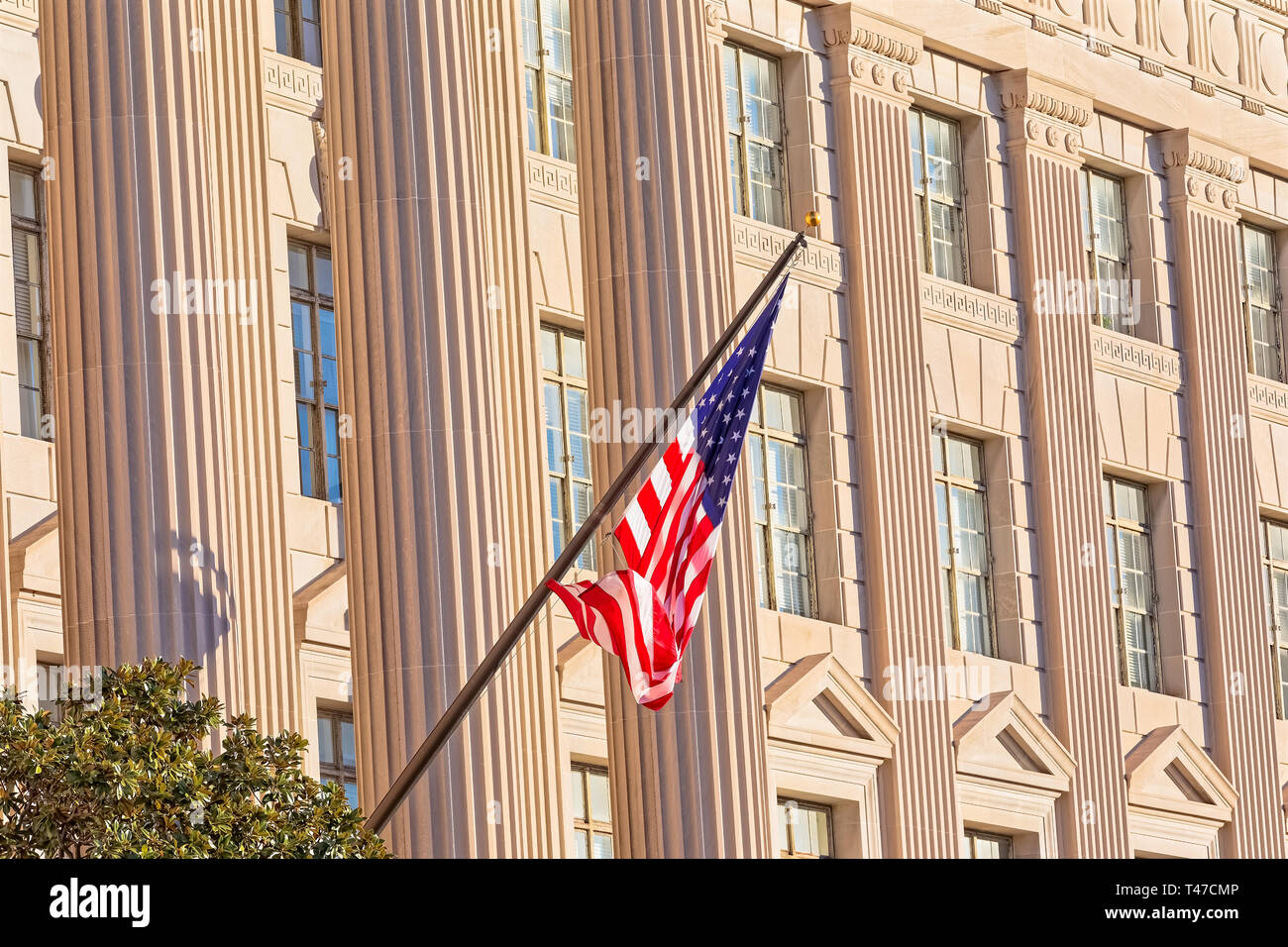 USA flag on facade of US Commerce building in Washington DC Stock Photo ...