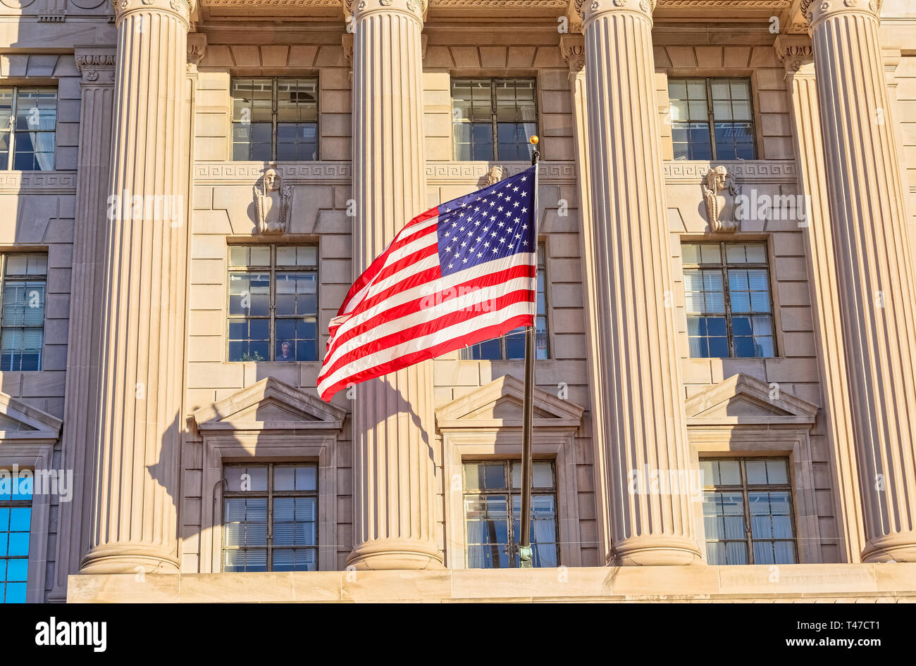 USA flag on facade of US Commerce building in Washington DC Stock Photo ...