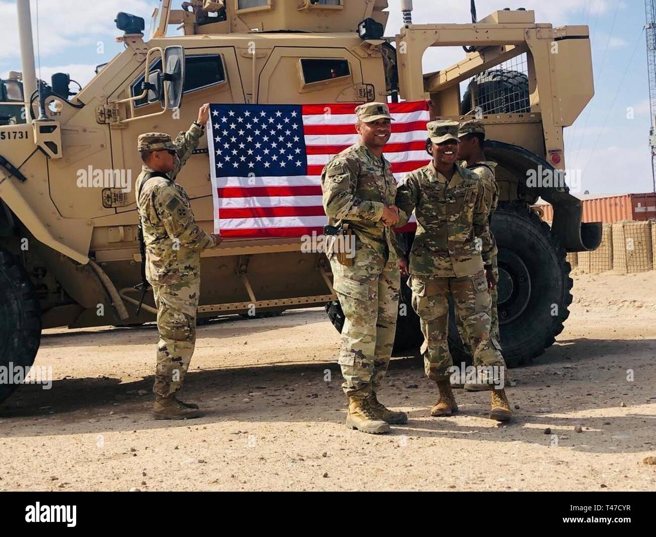 Spc. Latreya Gray, 247th Quartermaster Company, shares a congratulatory ...